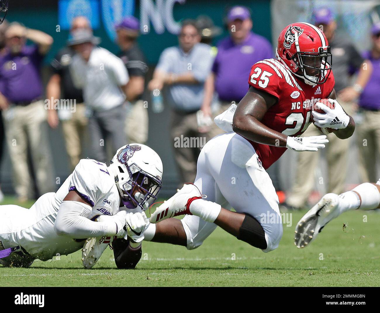 North Carolina State's Reggie Gallaspy II (25) is tripped by James ...