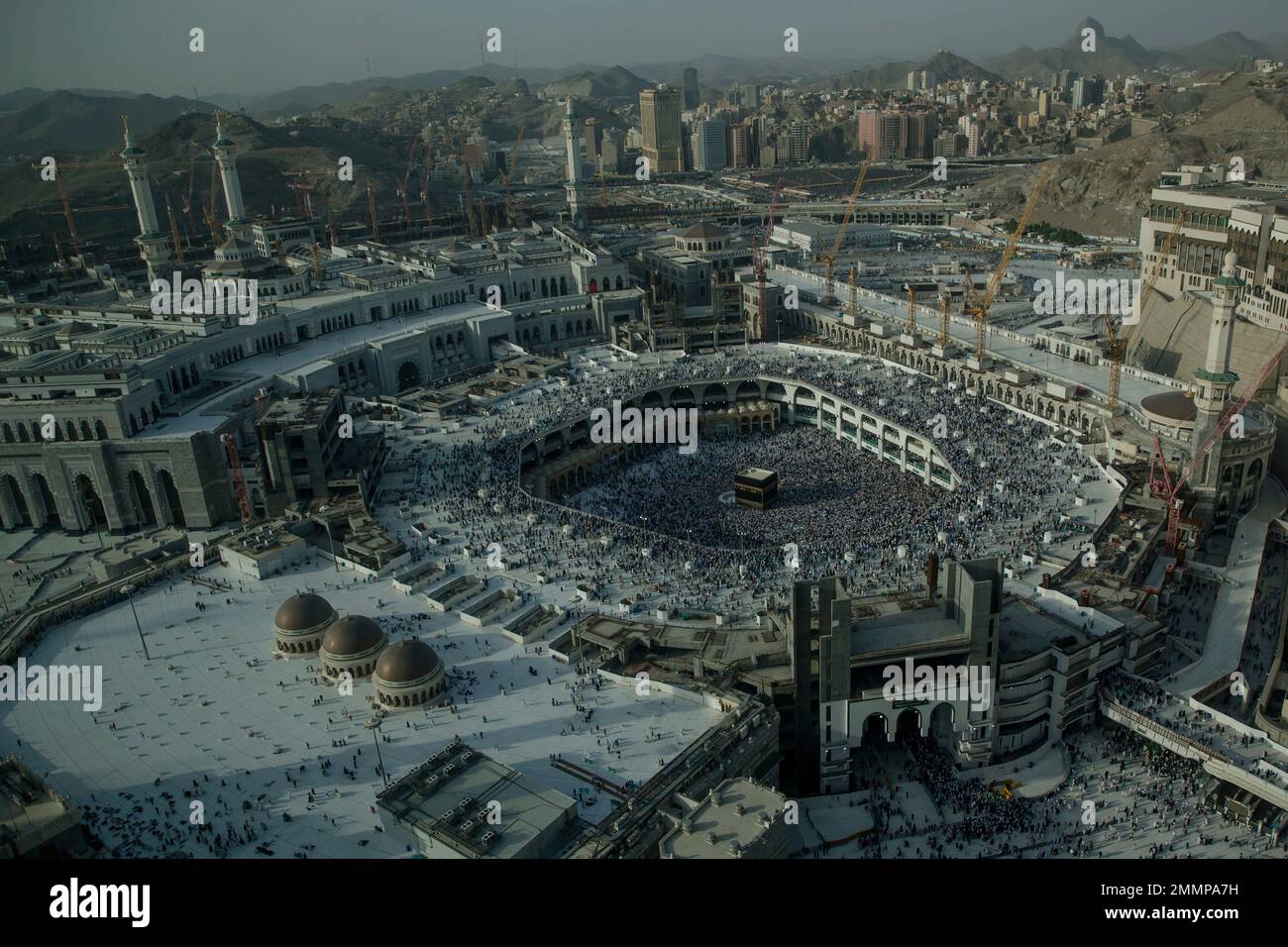 Muslim pilgrims perform the farewell circling of the Kaaba, the cubic ...