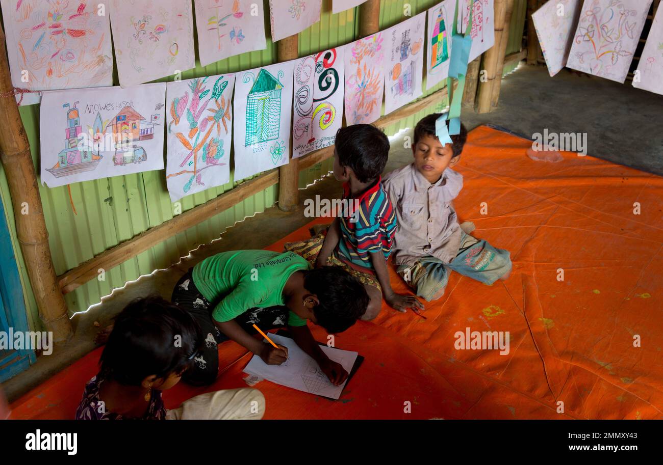 In this Jan. 21, 2018, photo, Rohingya refugee children draw and paint ...