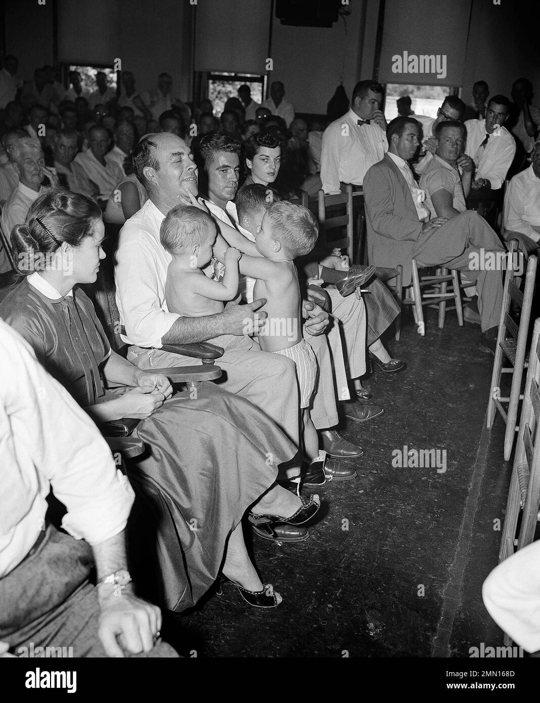 J. W. Milam, left, is touched on the chin by his five-year-old son, Bil ...