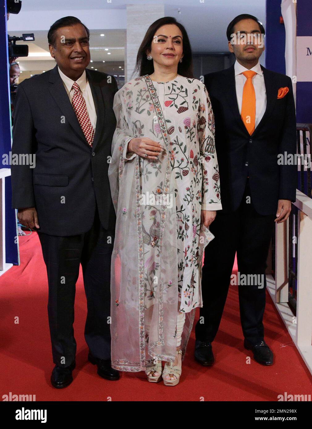 Chairman of Reliance Industries Limited Mukesh Ambani, left, along with his wife Nita Ambani and ...
