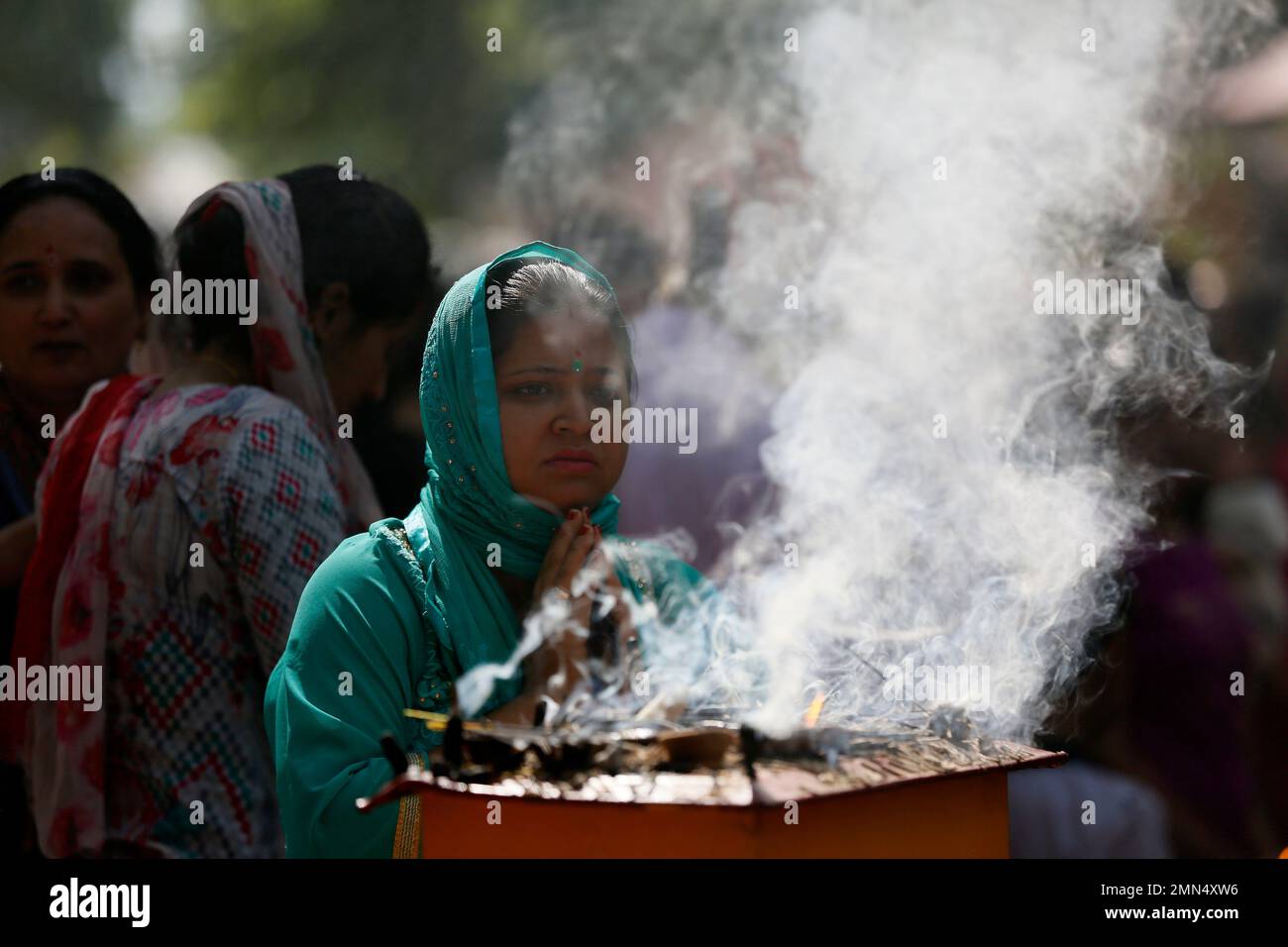 Kashmiri Hindu devotees known as "pandits" offer prayers during the ...