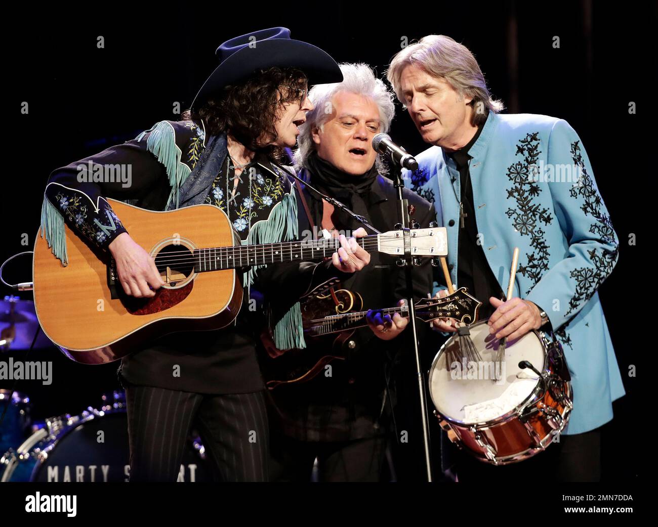 Marty Stuart, center, performs with members of his band, the Fabulous ...