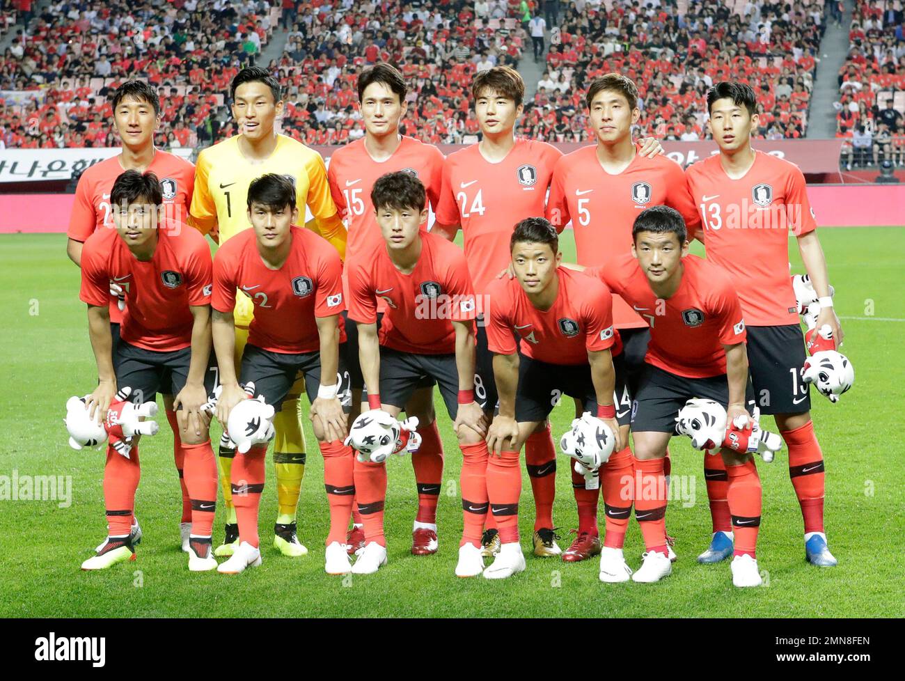South Korea's national soccer team players, front row from left, Koo Ja ...