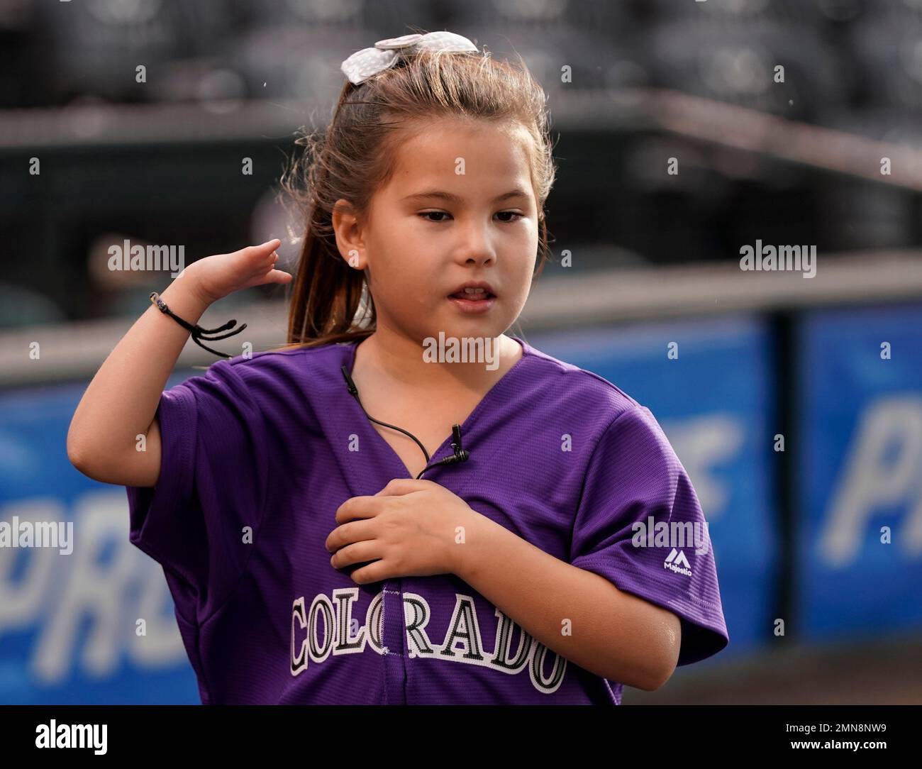 Hailey Dawson, 8, from Las Vegas throws out the first pitch before the ...