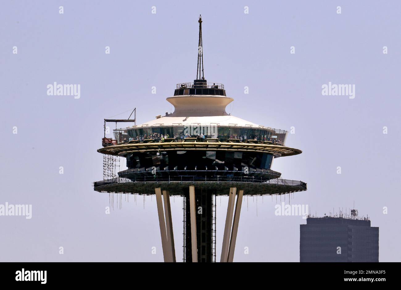 A floor of scaffolding remains below the upper portion of the Space ...
