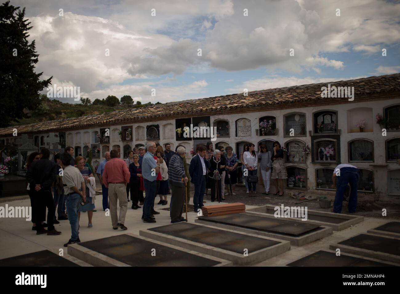 People stand as the remains of Casto Mercado Molada, Angel Vinas Diaz ...