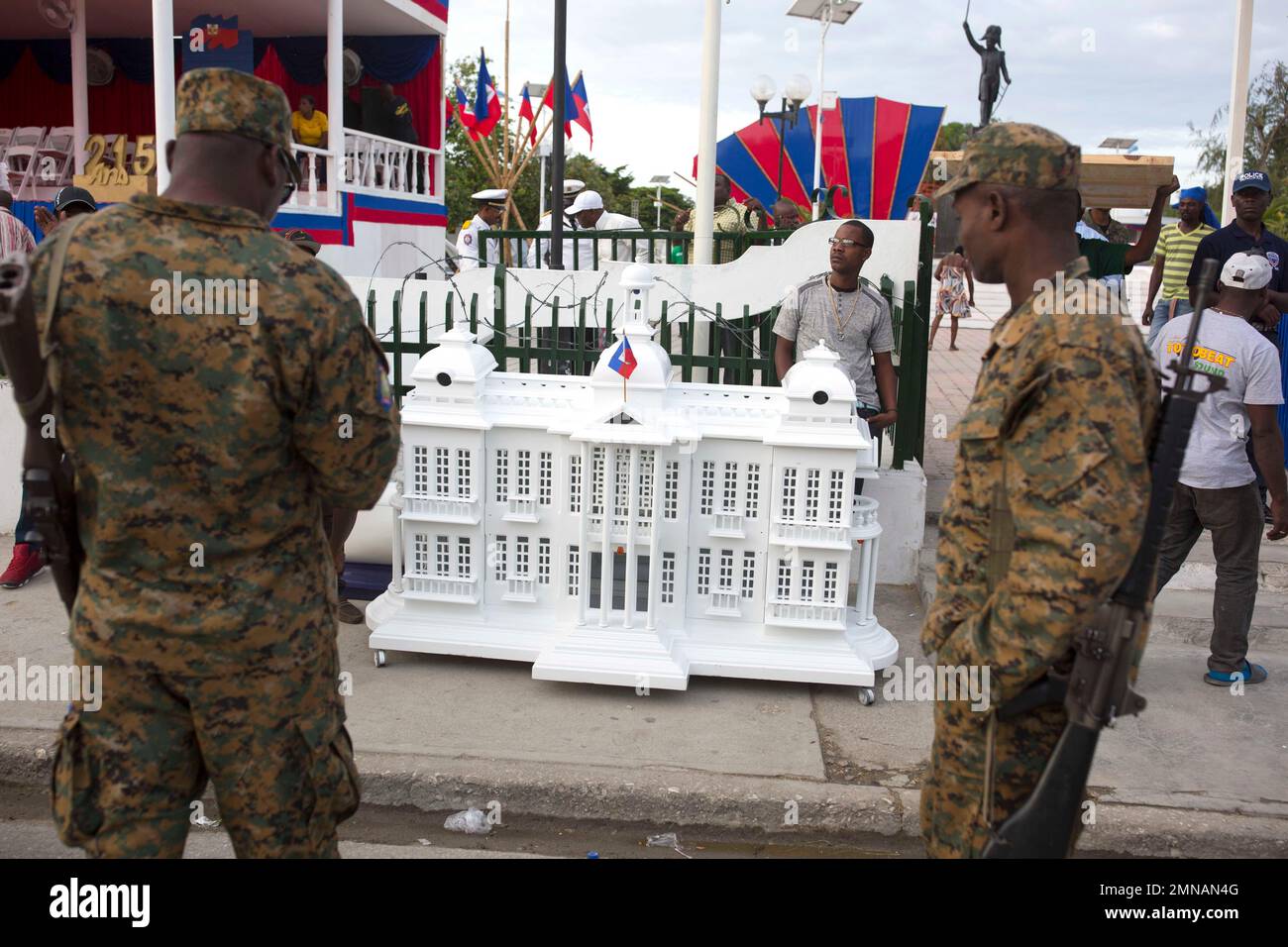 National police officers watch model of the former national palace ...