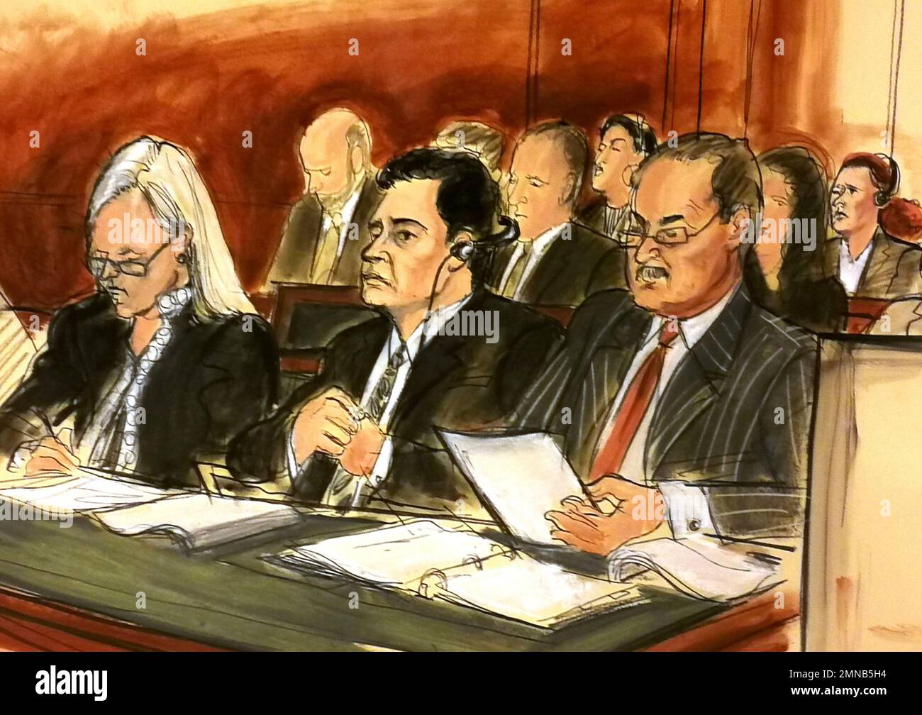 In this courtroom sketch Mehmet Hakan Atilla, second from left, listens ...