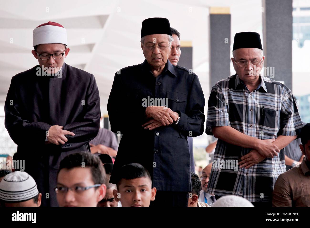 Malaysian Prime Minister Mahathir Mohamad, center, attends Friday ...