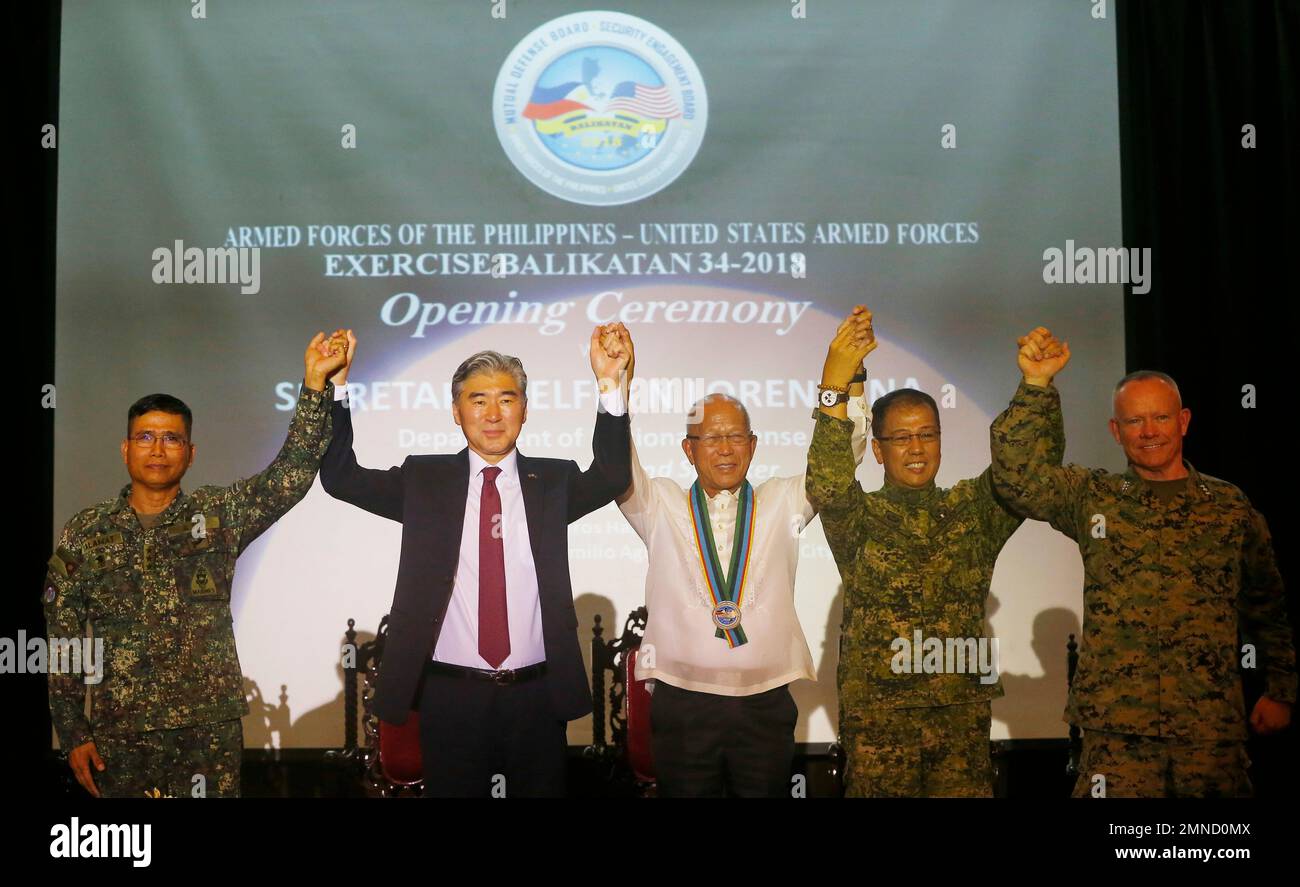 Philippine Defense Secretary Delfin Lorenzana, center, U.S. Ambassador ...