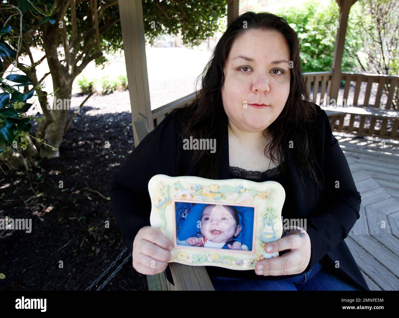 In this Thursday, April 19, 2018 photo, Alyssa Pladl, holds a photo of ...