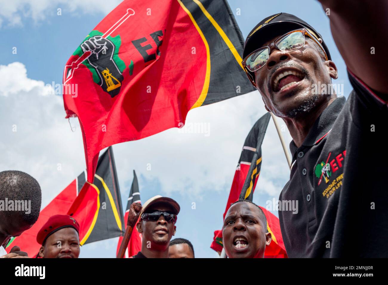 Members of the Economic Freedom Fighters gather outside the family home ...