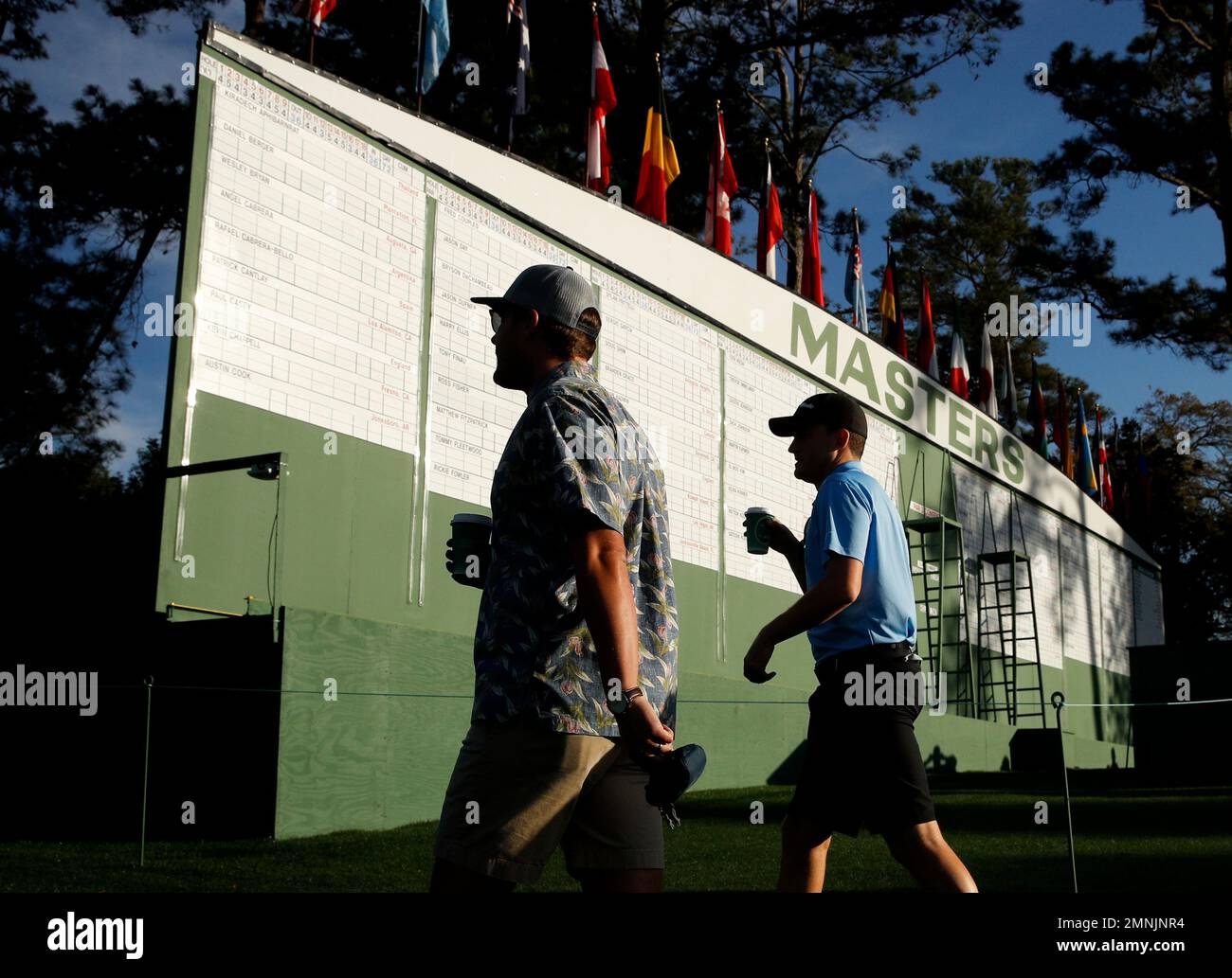 Patrons arrive for a practice round at the Masters golf tournament at ...