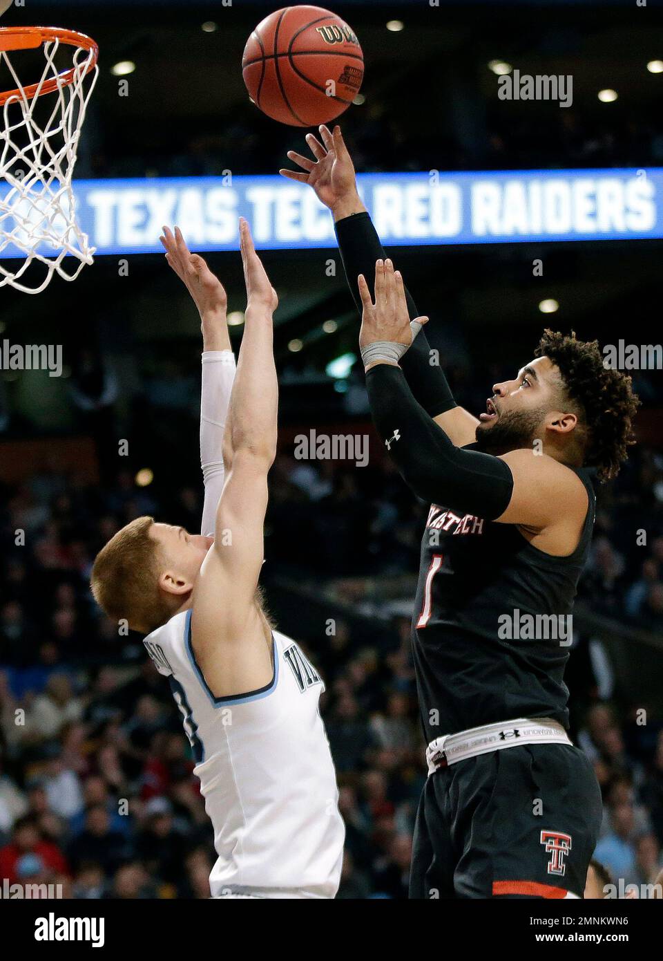 Texas Tech's Brandone Francis, right, shoots over Villanova's Donte ...