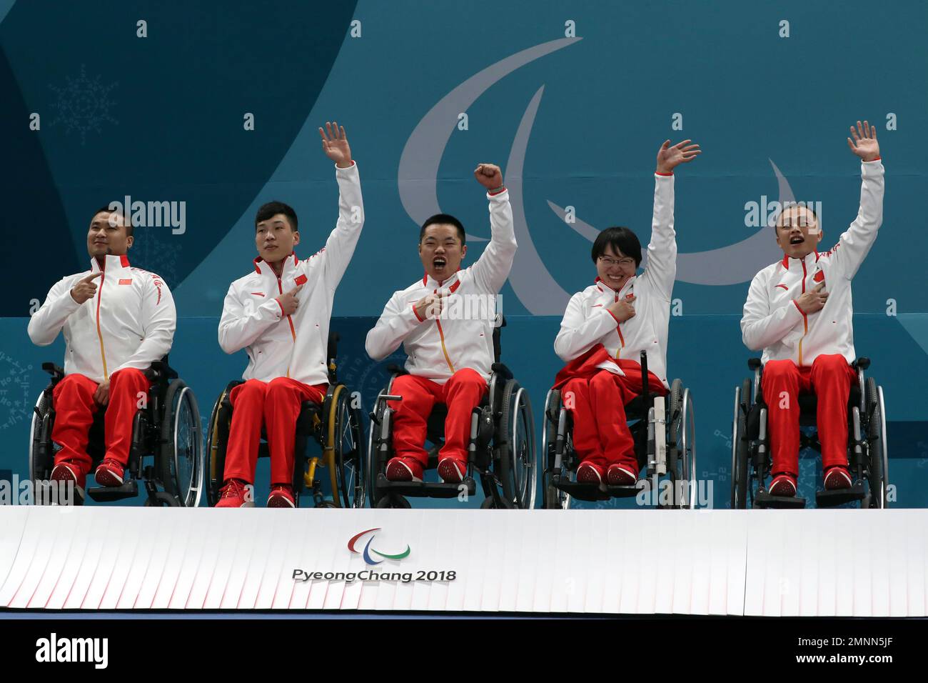 Members of China's wheelchair curling team from left Wang Haitao, Chen Jianxin, Liu Wei, Wang ...