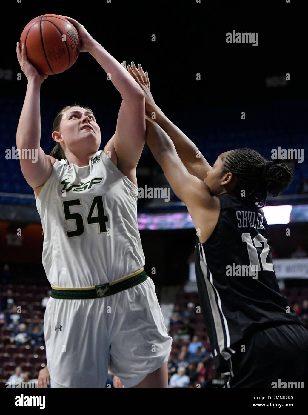 South Florida's Alyssa Rader, left, shoots over Central Florida's Nyala ...