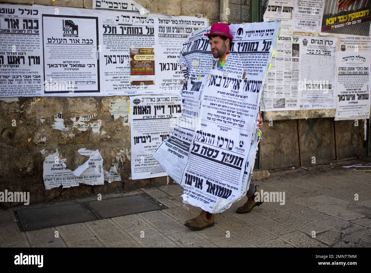 A Jewish man wears a costume during the Jewish holiday of Purim in Mea ...