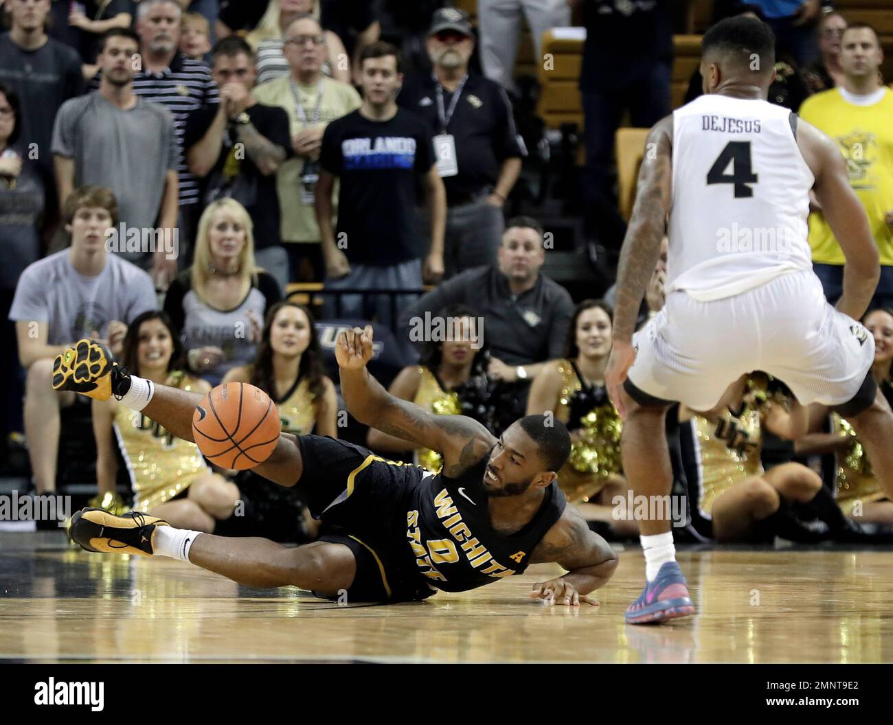 Wichita State's Rashard Kelly, left, goes after a loose ball in front ...