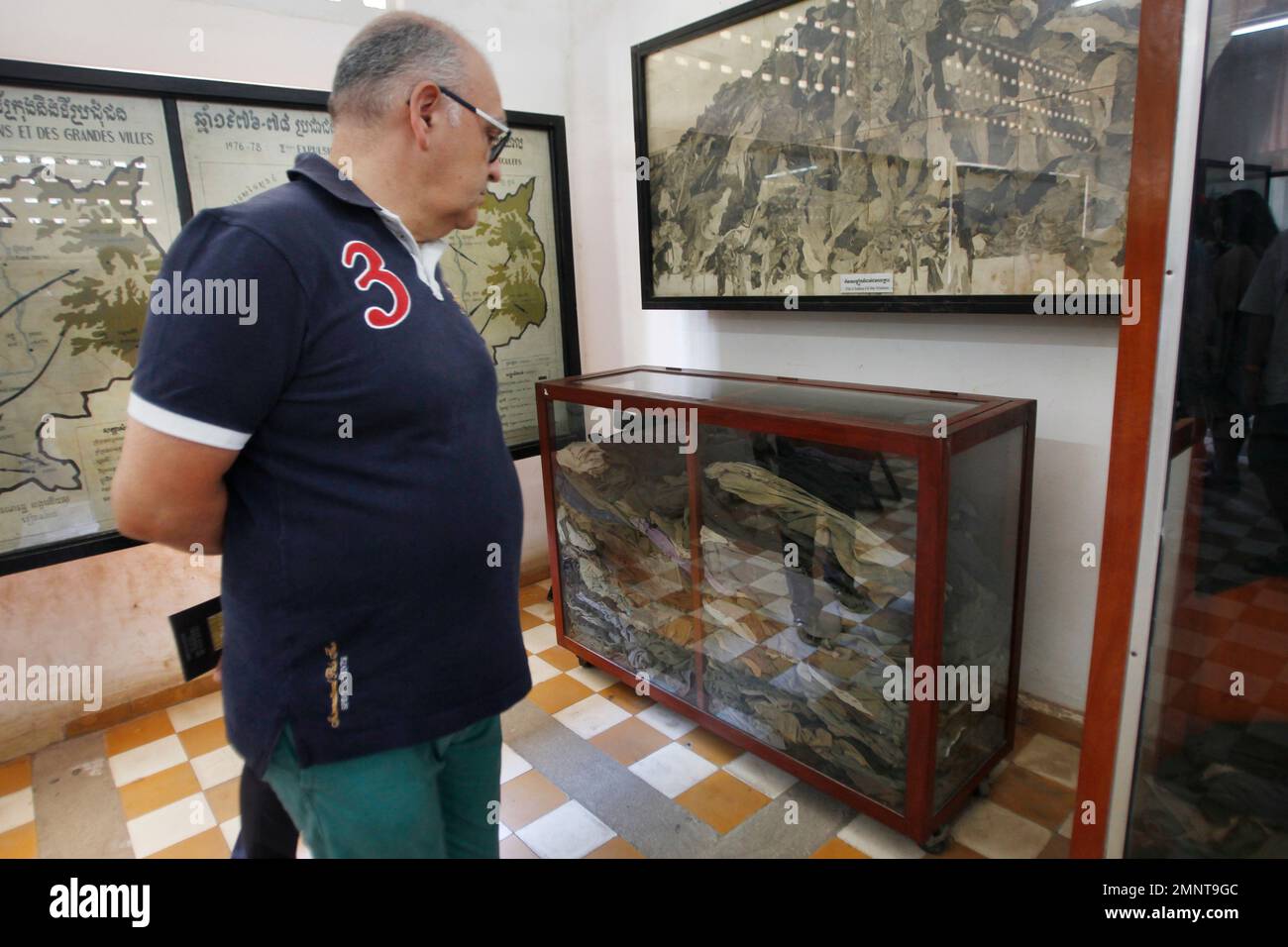 In this Feb. 5, 2018, photo, a tourist views piles of clothing from the ...