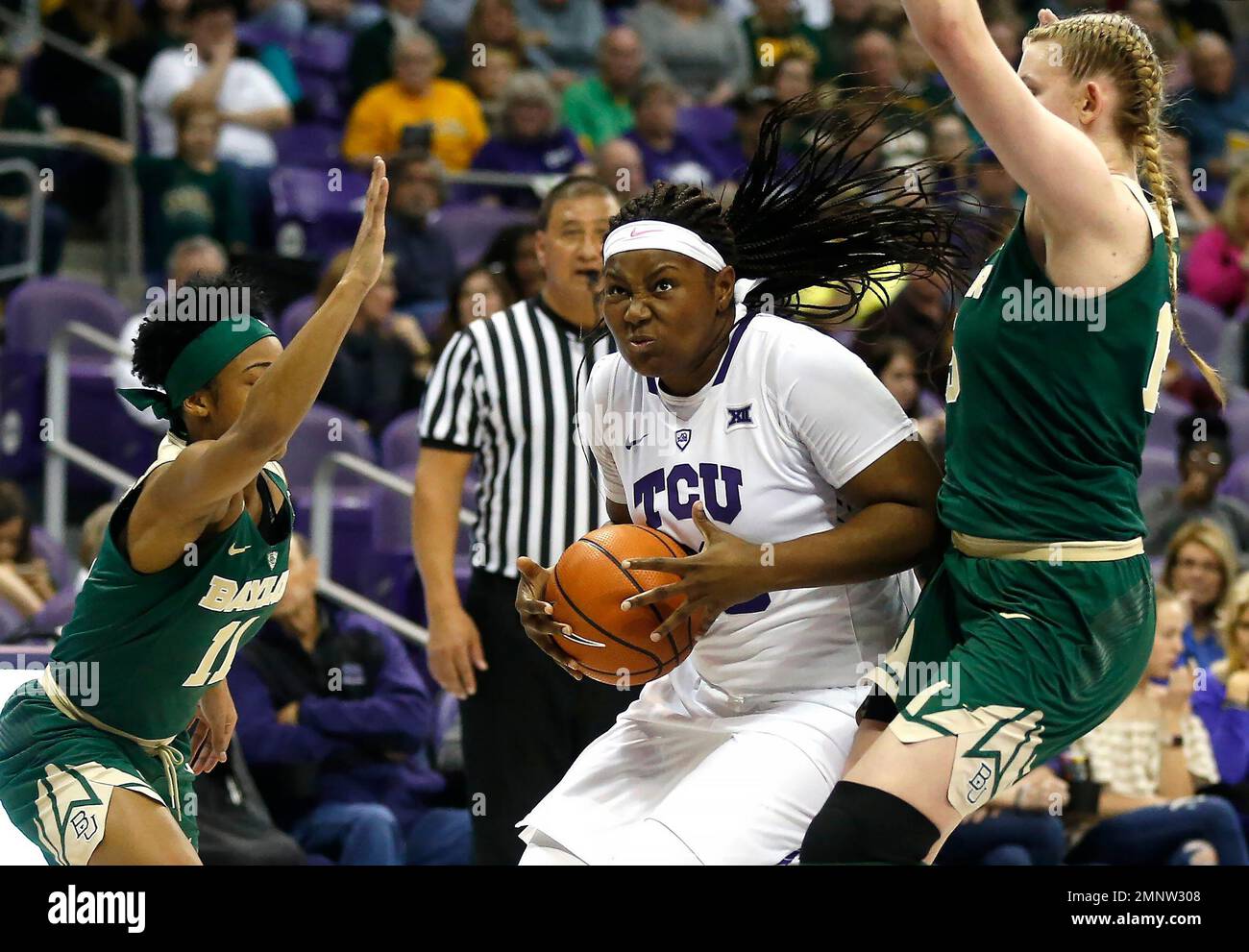 TCU forward Amy Okonkwo (00) tries to get past Baylor guard Alexis ...
