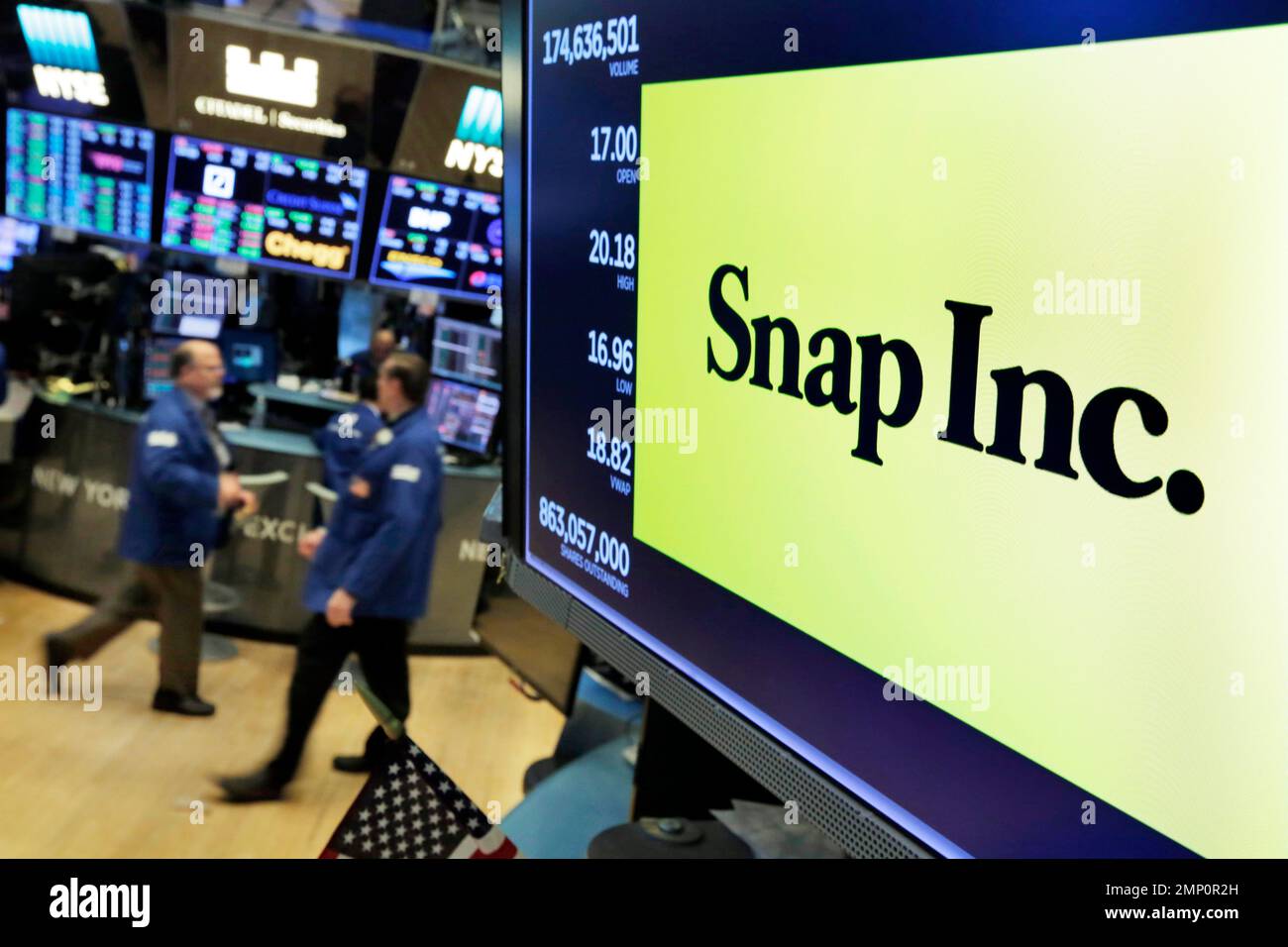 The logo for Snap Inc. appears above a trading post on the floor of the ...
