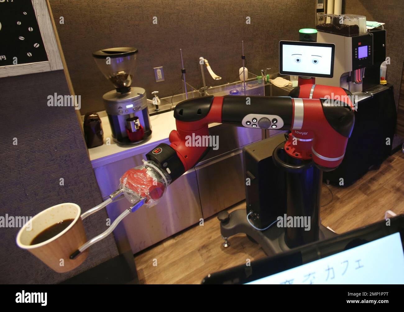 Robot barista named "Sawyer" makes a coffee at Henn-na Cafe, Japanese ...