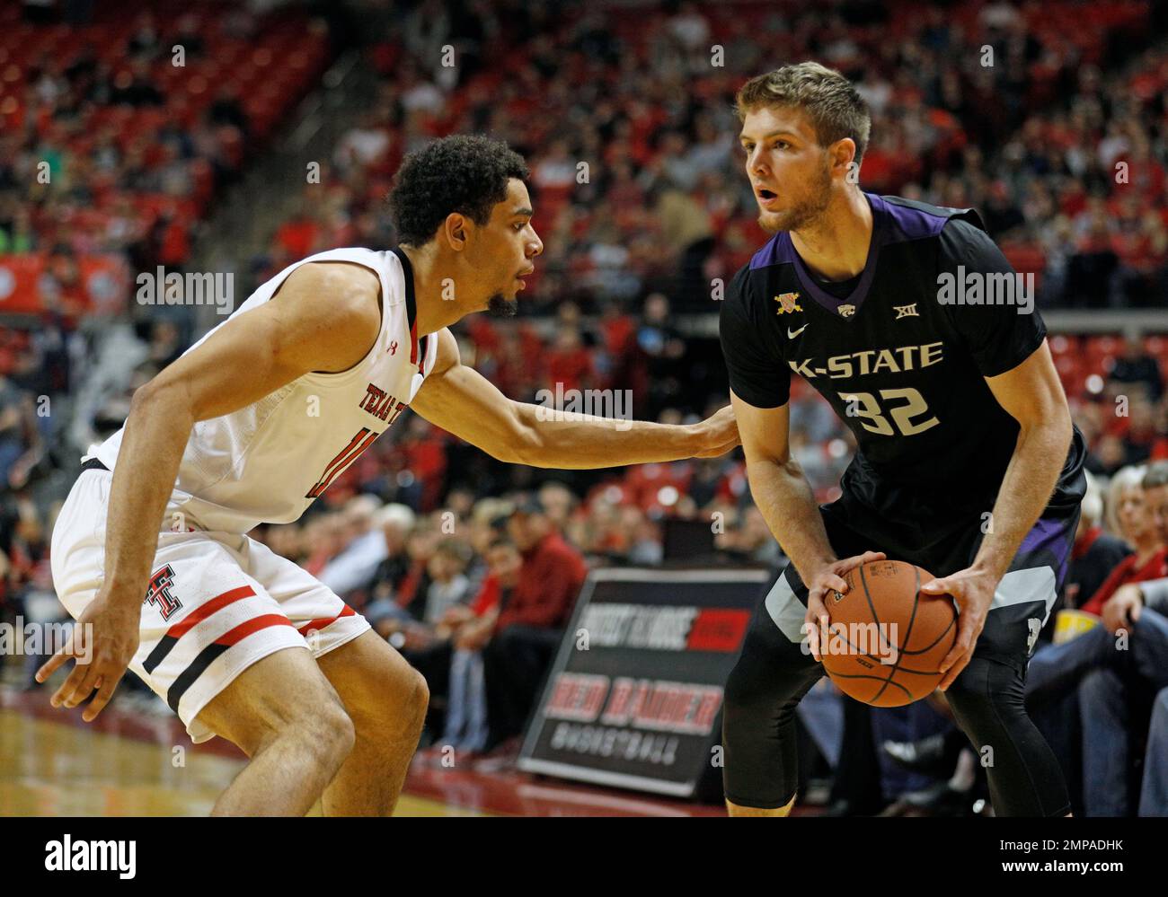 Kansas State's Dean Wade (32) looks to pass the ball around Texas Tech ...
