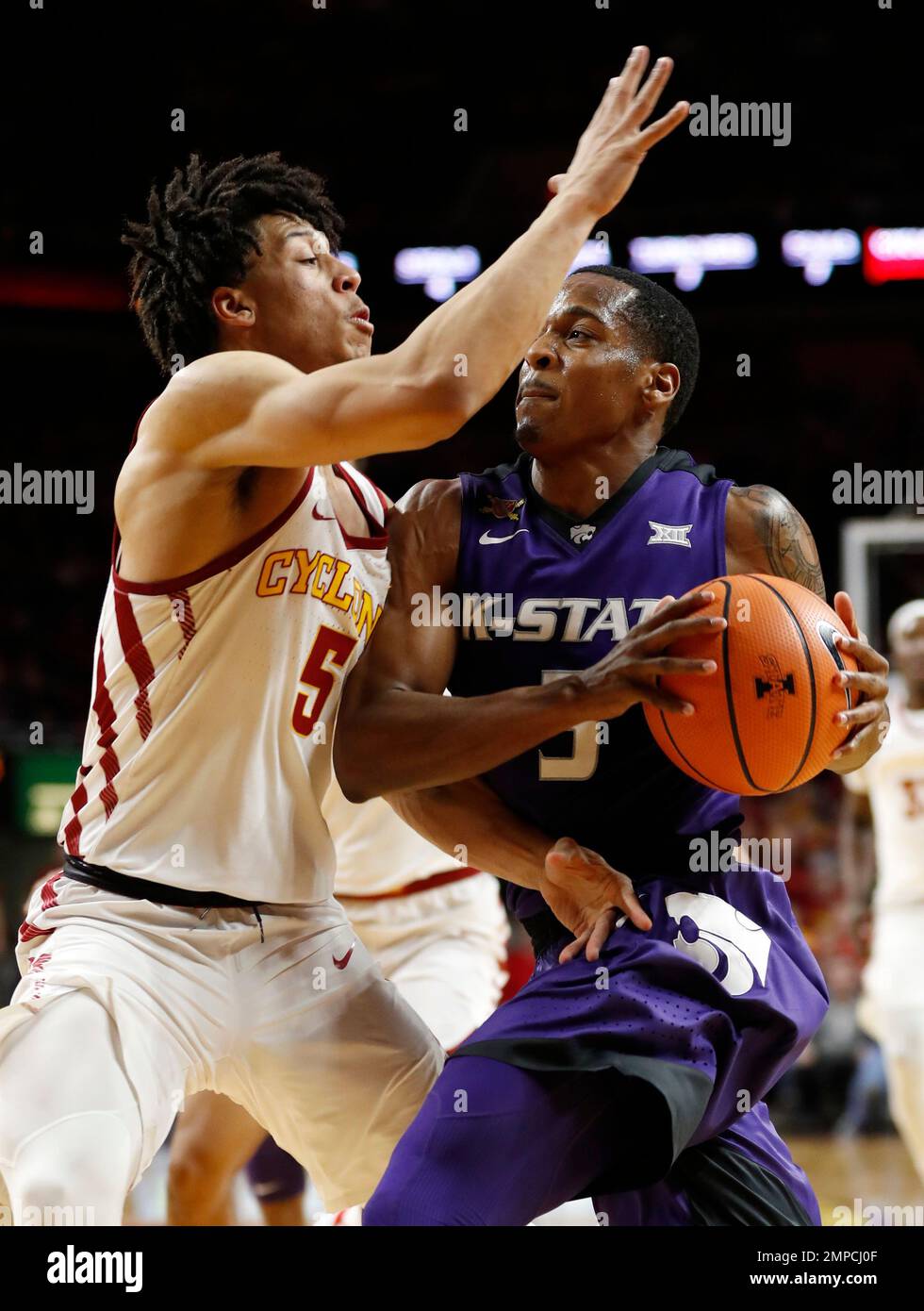 Kansas State guard Barry Brown, right, is fouled by Iowa State guard ...