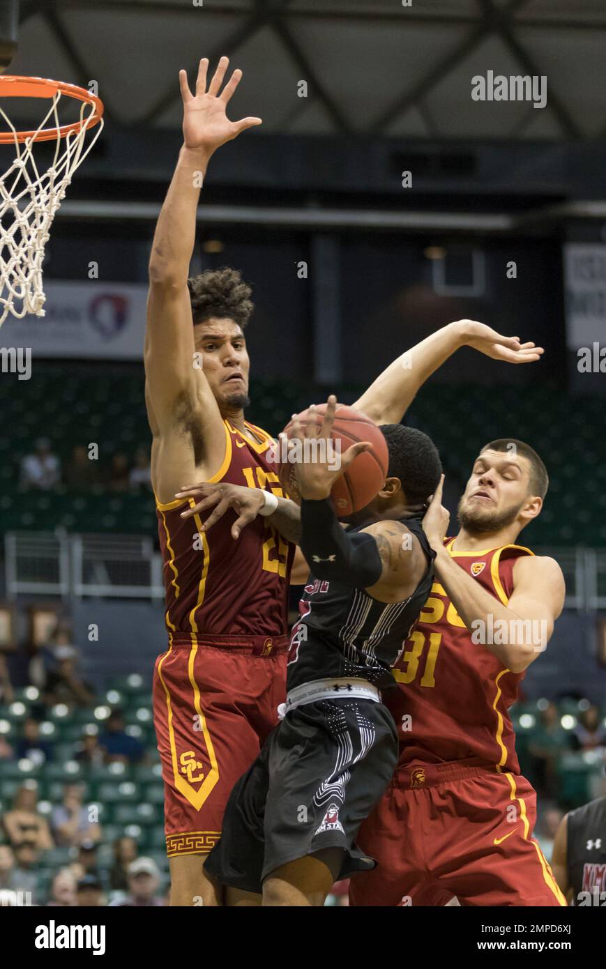 New Mexico State guard A.J. Harris, center, finds himself double teamed ...