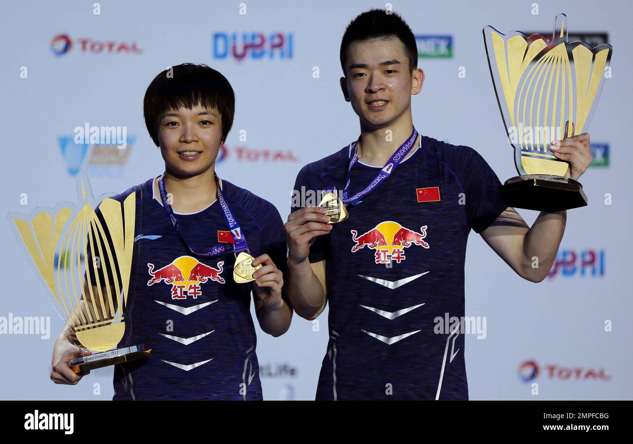 China's Siwei Zheng, right, and Qingchen Chen hold their trophies after ...