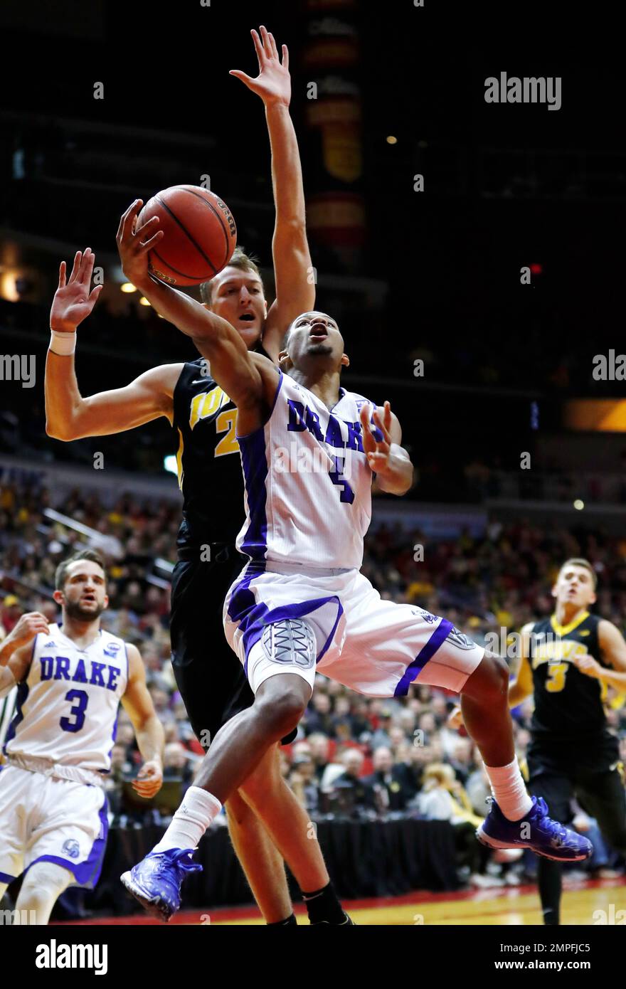 Drake guard De'Antae McMurray (4) drives to the basket ahead of Iowa ...