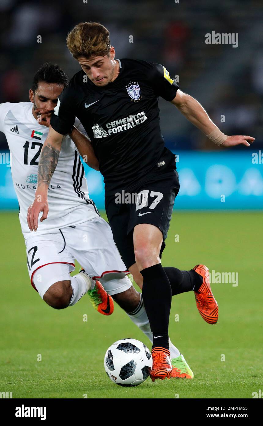 Pachuca's Angelo Sagal runs with the ball past Al Jazira's Salim Rashid ...