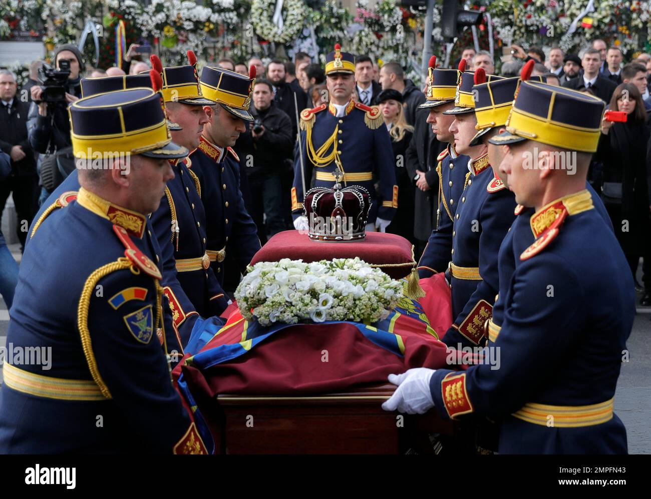 Honor guard soldiers carry the coffin of the late Romanian King Michael ...