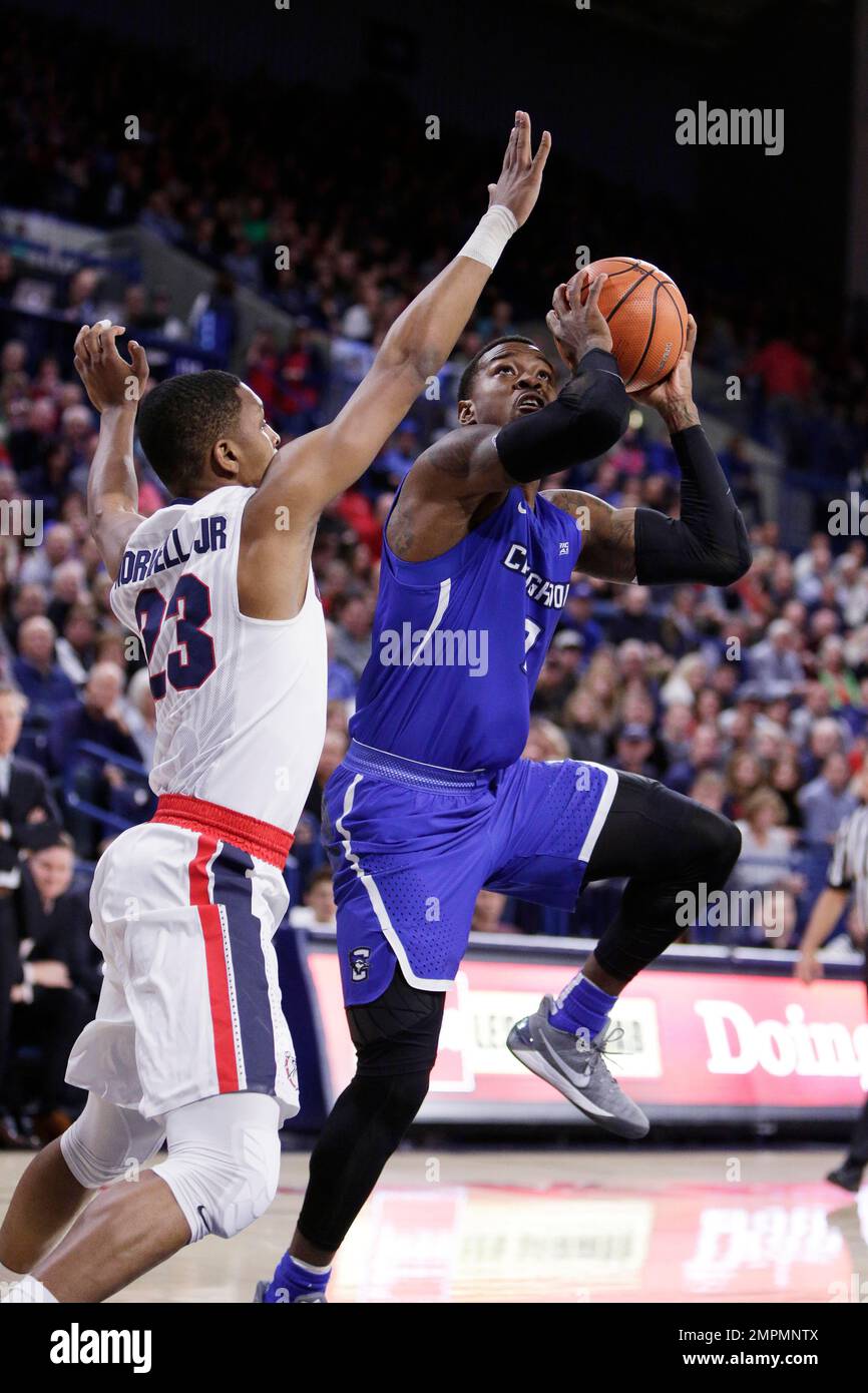 Creighton guard Marcus Foster, right, drives to the basket against ...