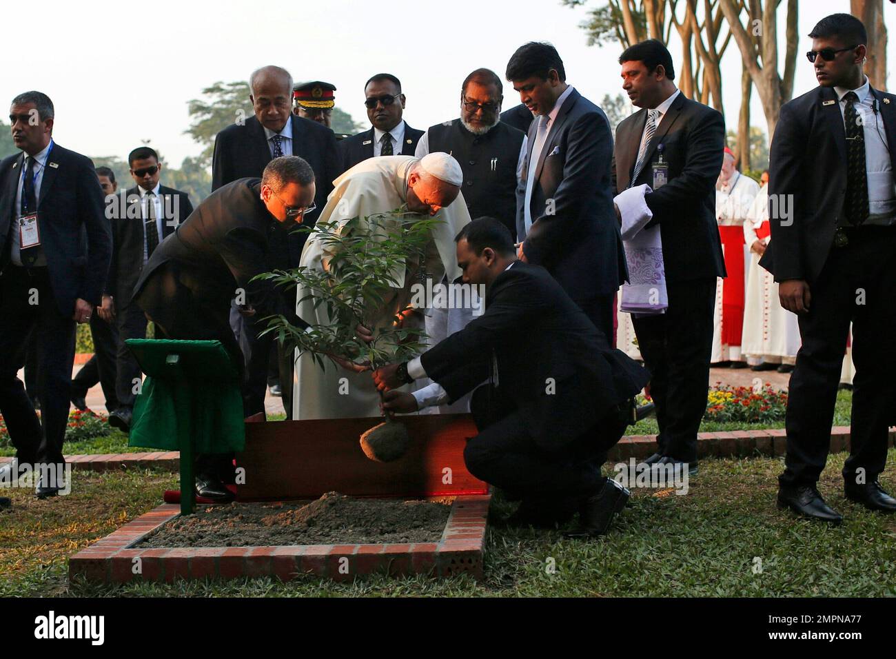 Pope Francis plants a tree as he visits the National Martyrs' Memorial ...