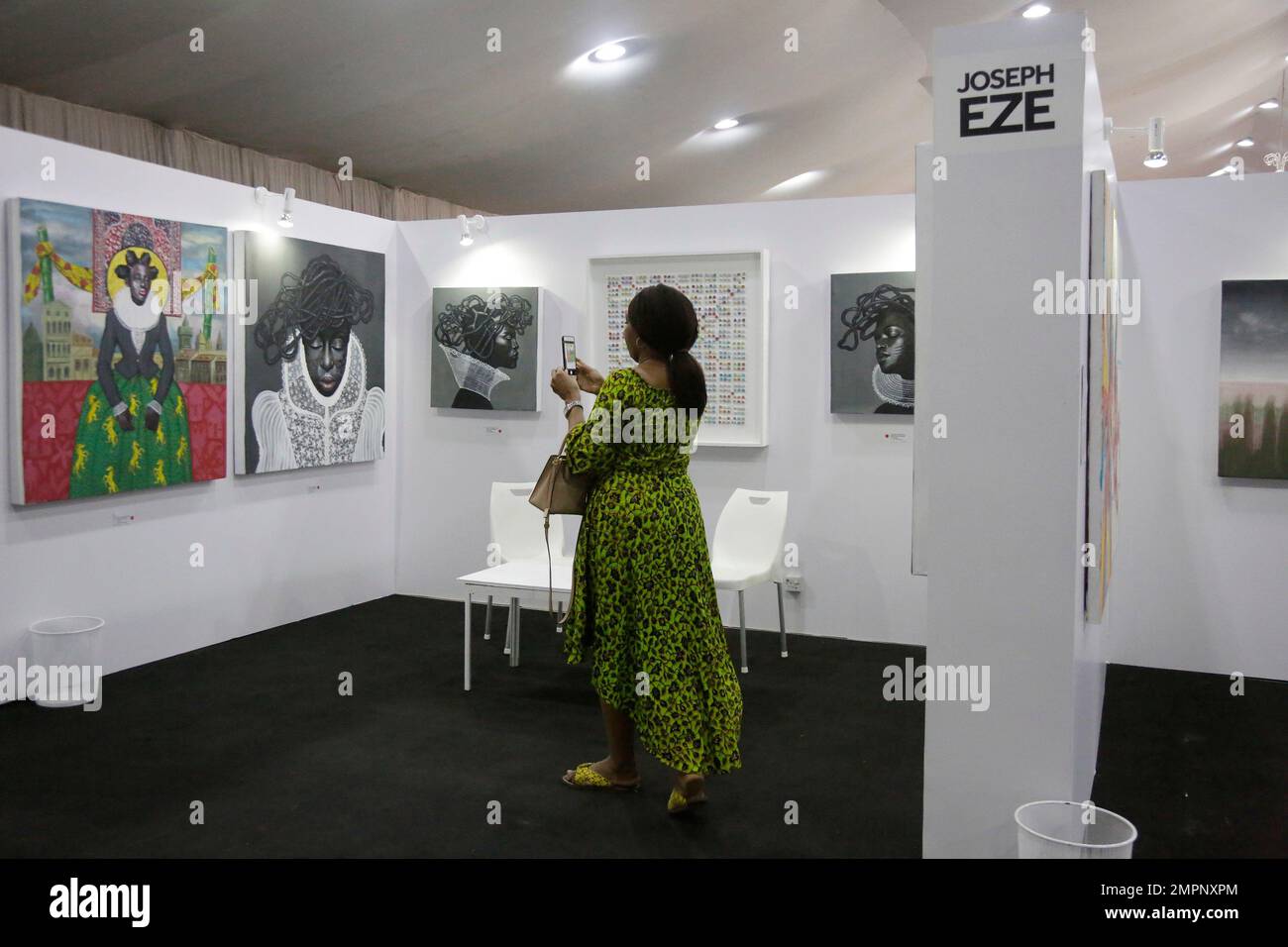 In this photo taken Friday, Nov. 10, 2017, a woman takes a photo of an ...