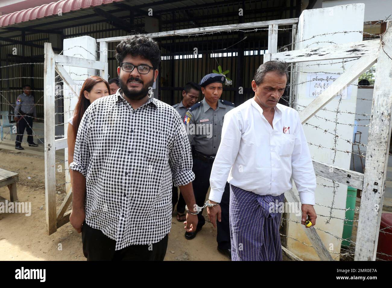 Burmese freelance journalist and interpreter Aung Naing Soe, left, and ...