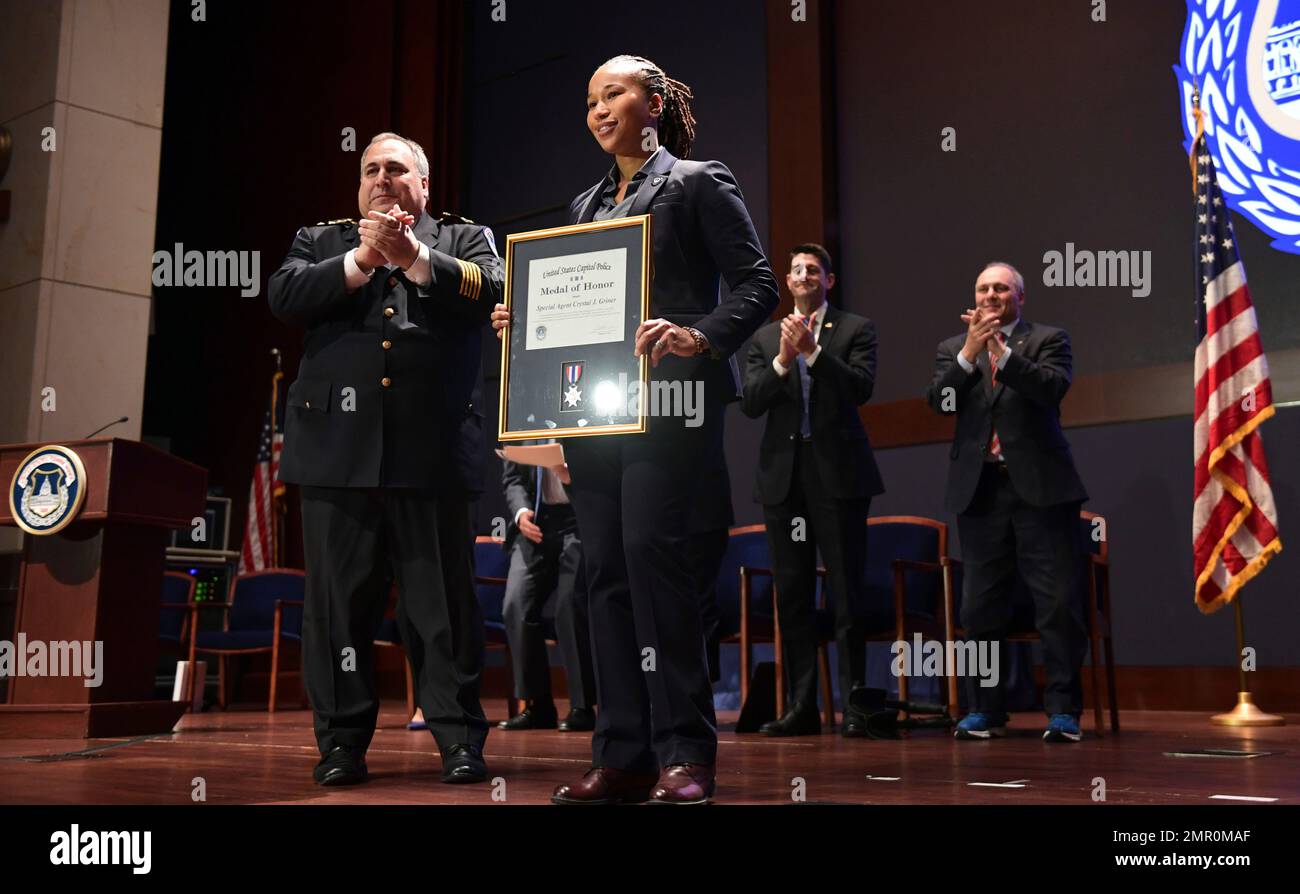 Capitol Hill Police Chief Matthew Verdarosa, left, presents Capitol ...