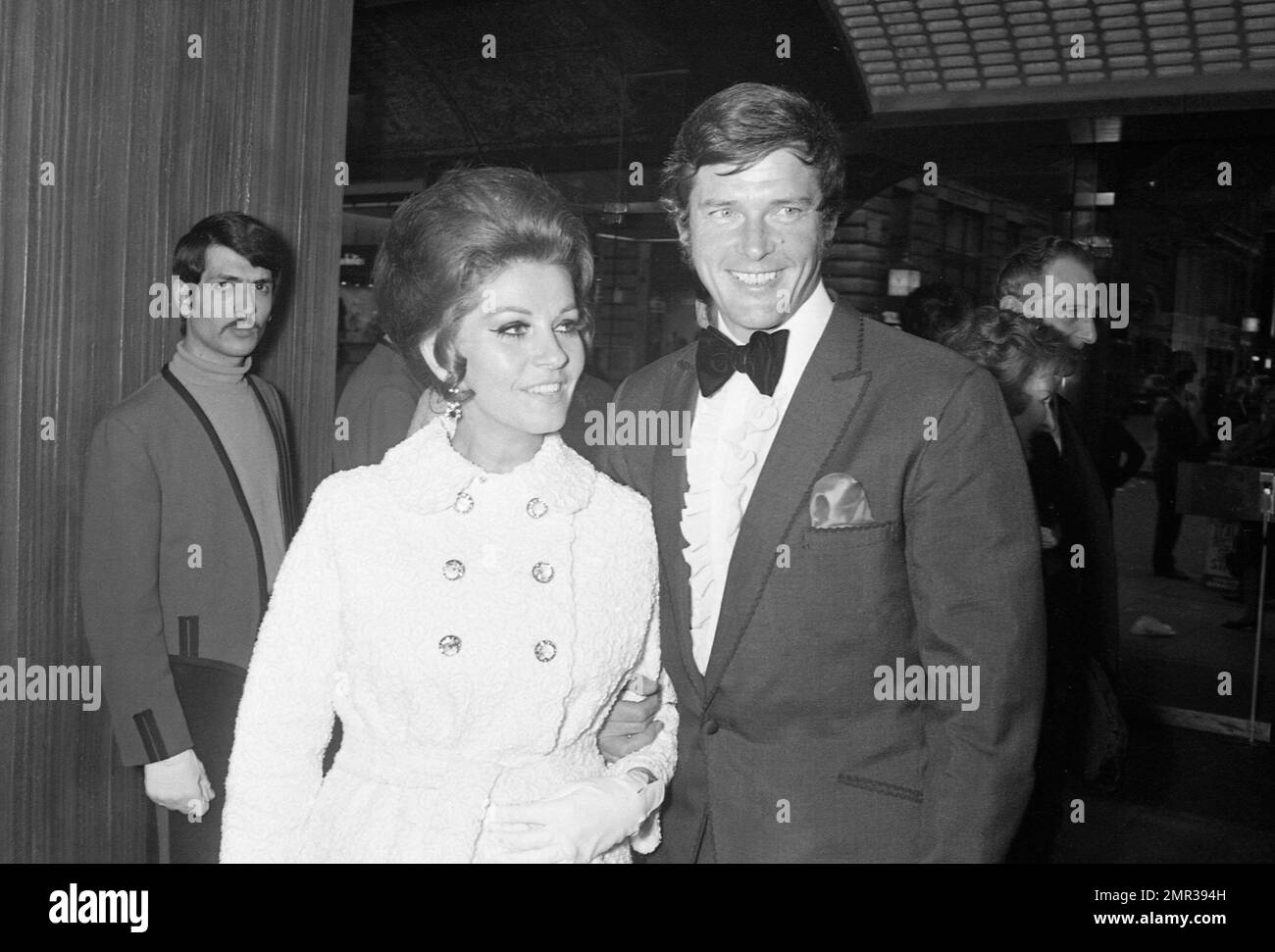 British actor Roger Moore and Italian actress Luisa Mattioli arrive at ...