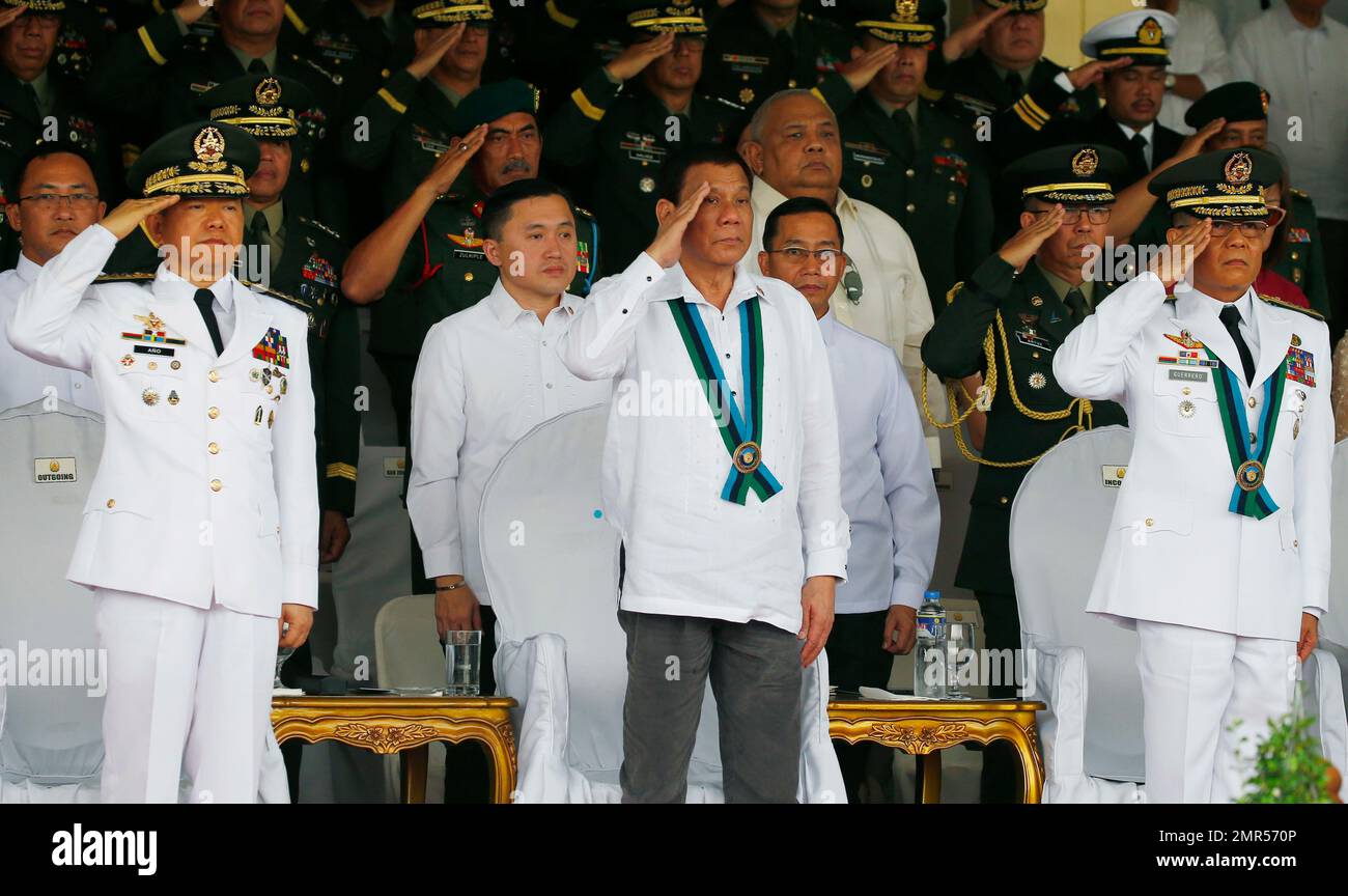 Philippine President Rodrigo Duterte, center, retiring Philippine Armed ...