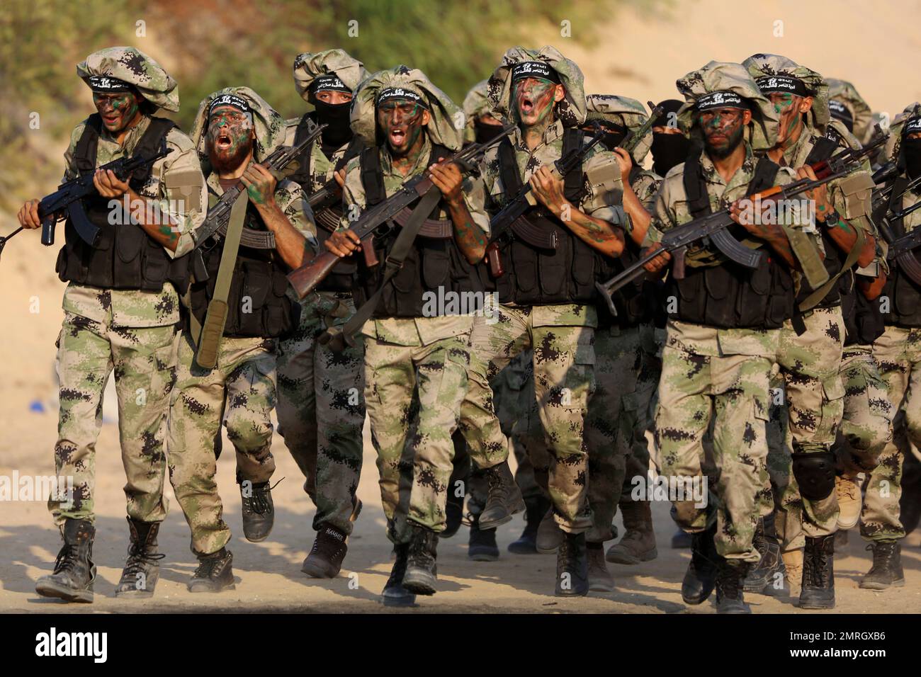 Masked militants from the al-Nasser Brigades, an armed wing of the Popular Resistance Committees ...