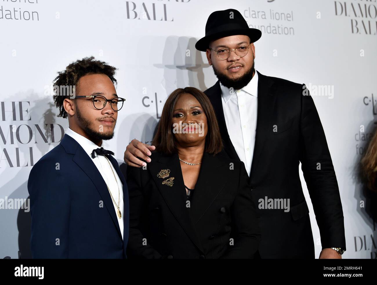 Monica Braithwaite, center, poses with sons Rajad Fenty, left, and ...