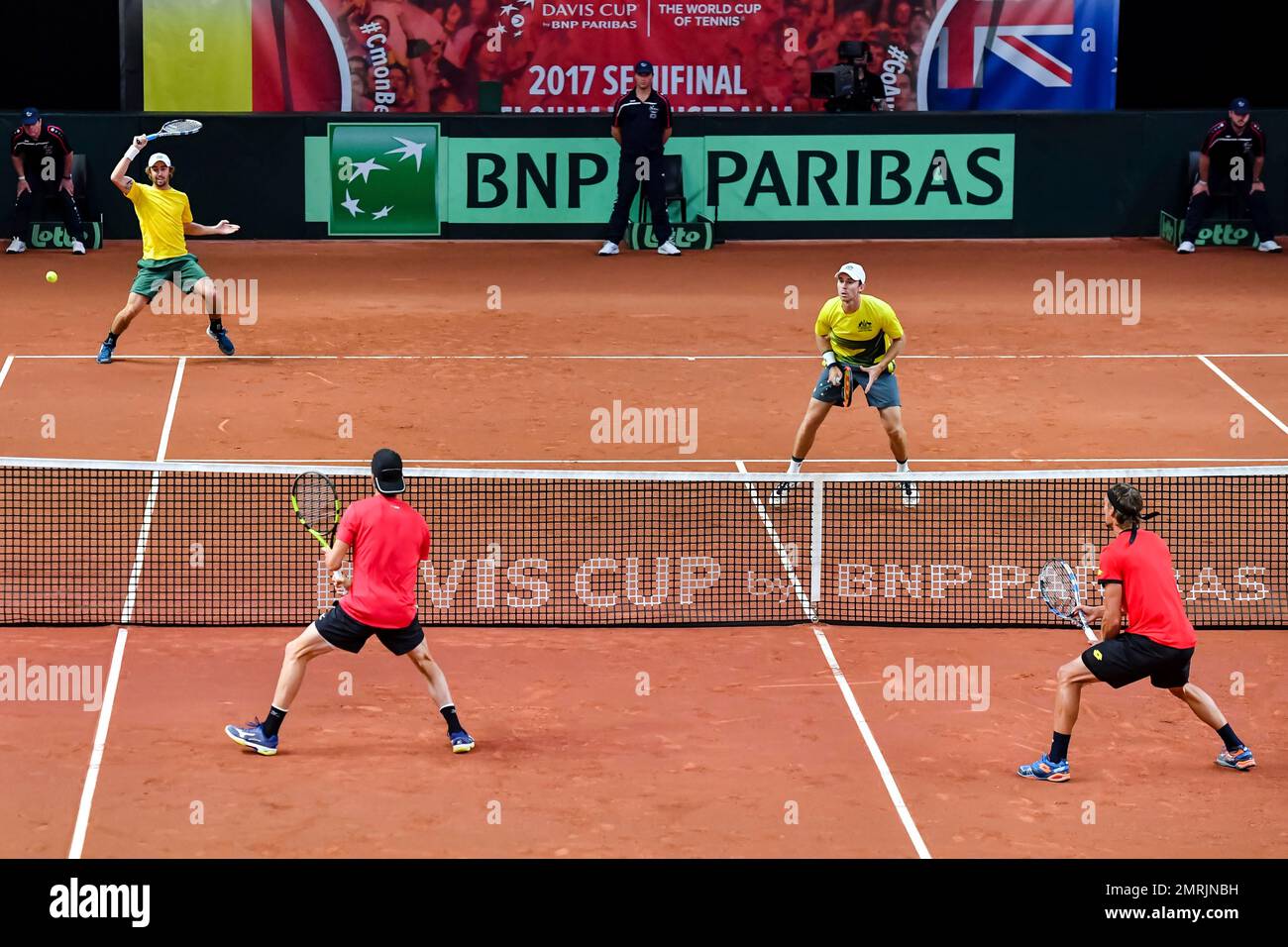 Australia's John Peers, top left, and Jordan Thompson return the ball ...