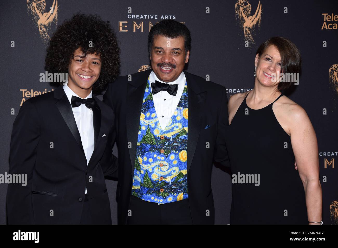 Travis Tyson, from left, Neil deGrasse Tyson, and Alice Young arrive at ...