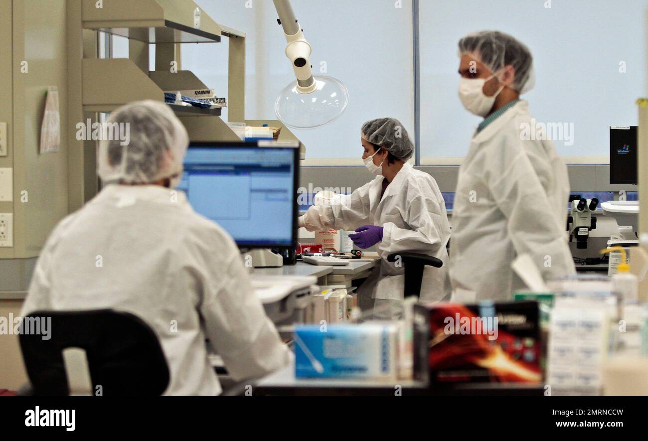 FILE- In this April 15, 2014 file photo, criminalist trainees work at a ...