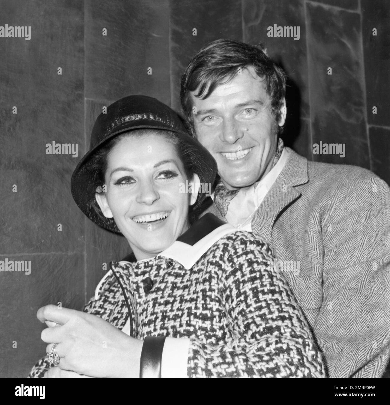 British actor Roger Moore is pictured with his wife to be Italian ...