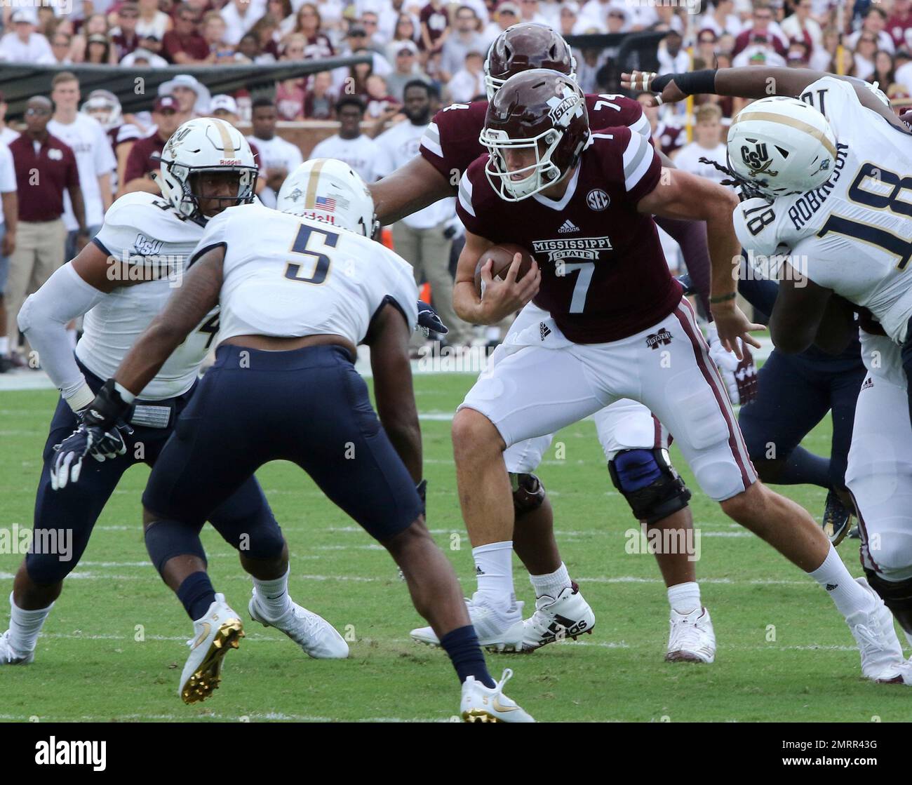Mississippi State quarterback Nick Fitzgerald (7) is surrounded by ...