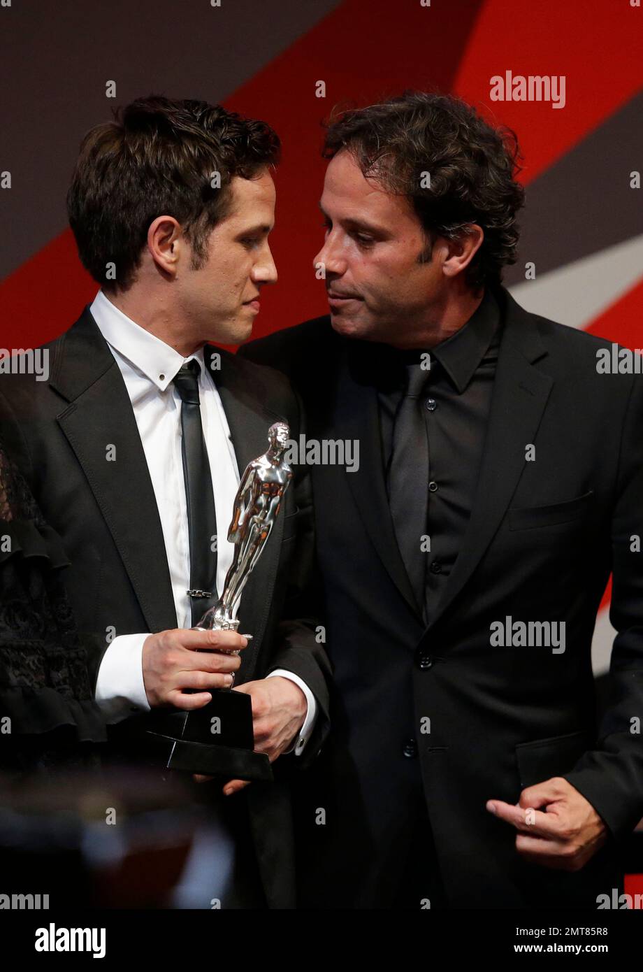 Adrian Ladron, left, winner of the best actor award, talks with Andoni ...