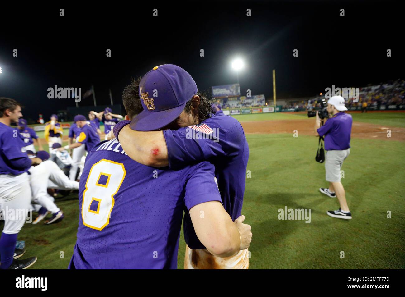 LSU infielder Kramer Robertson hugs infielder Cole Freeman (8) after ...